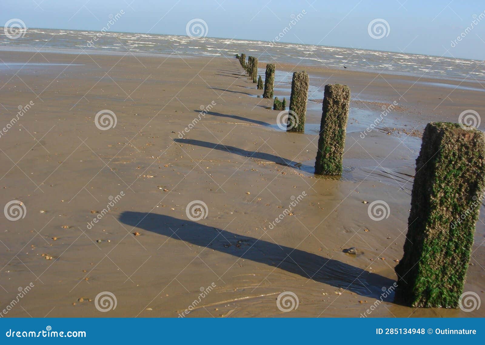Shadow beach poles stock photo. Image of decaying, seascapes - 285134948