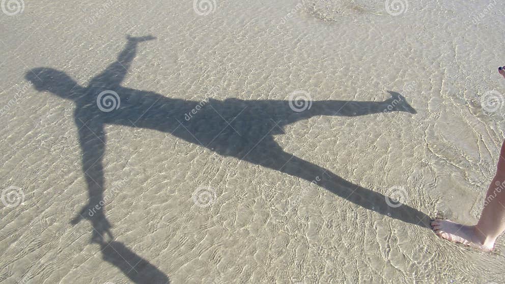 Shadow on the Beach stock image. Image of sunny, beach - 77454539