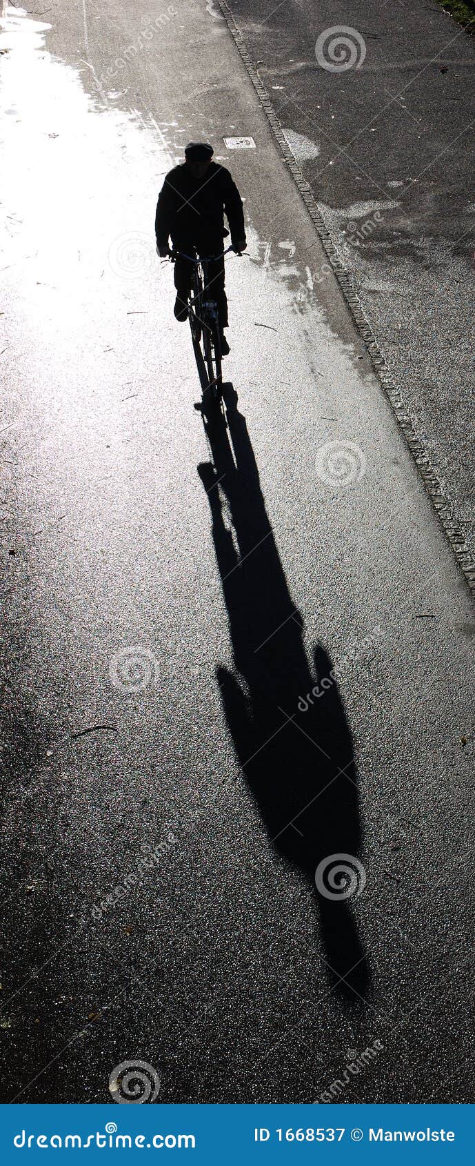 Shadow of a bicyclist stock image. Image of endurance - 1668537