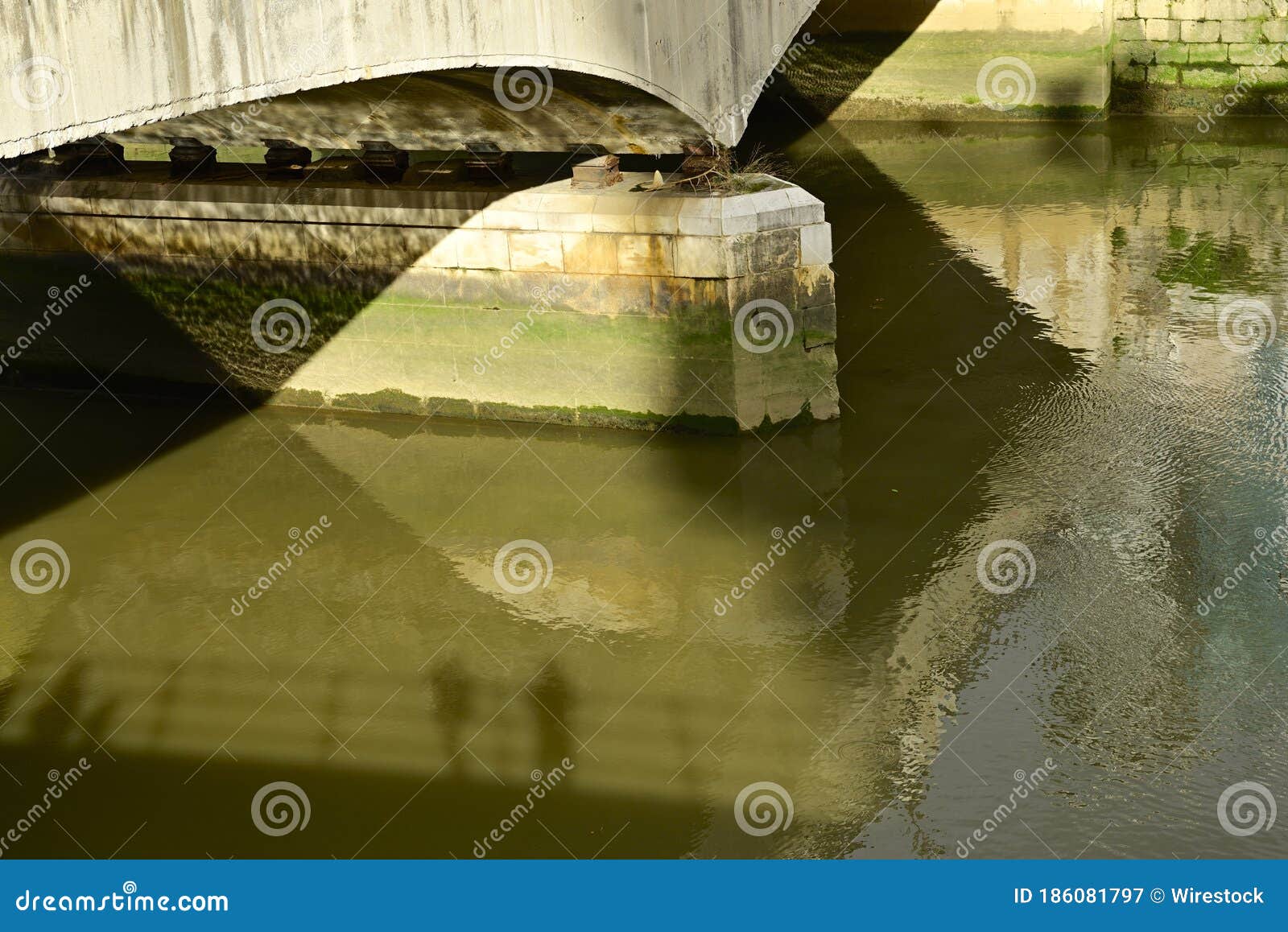 Shadow of the Bridge Falling on the Water Stock Image - Image of light ...