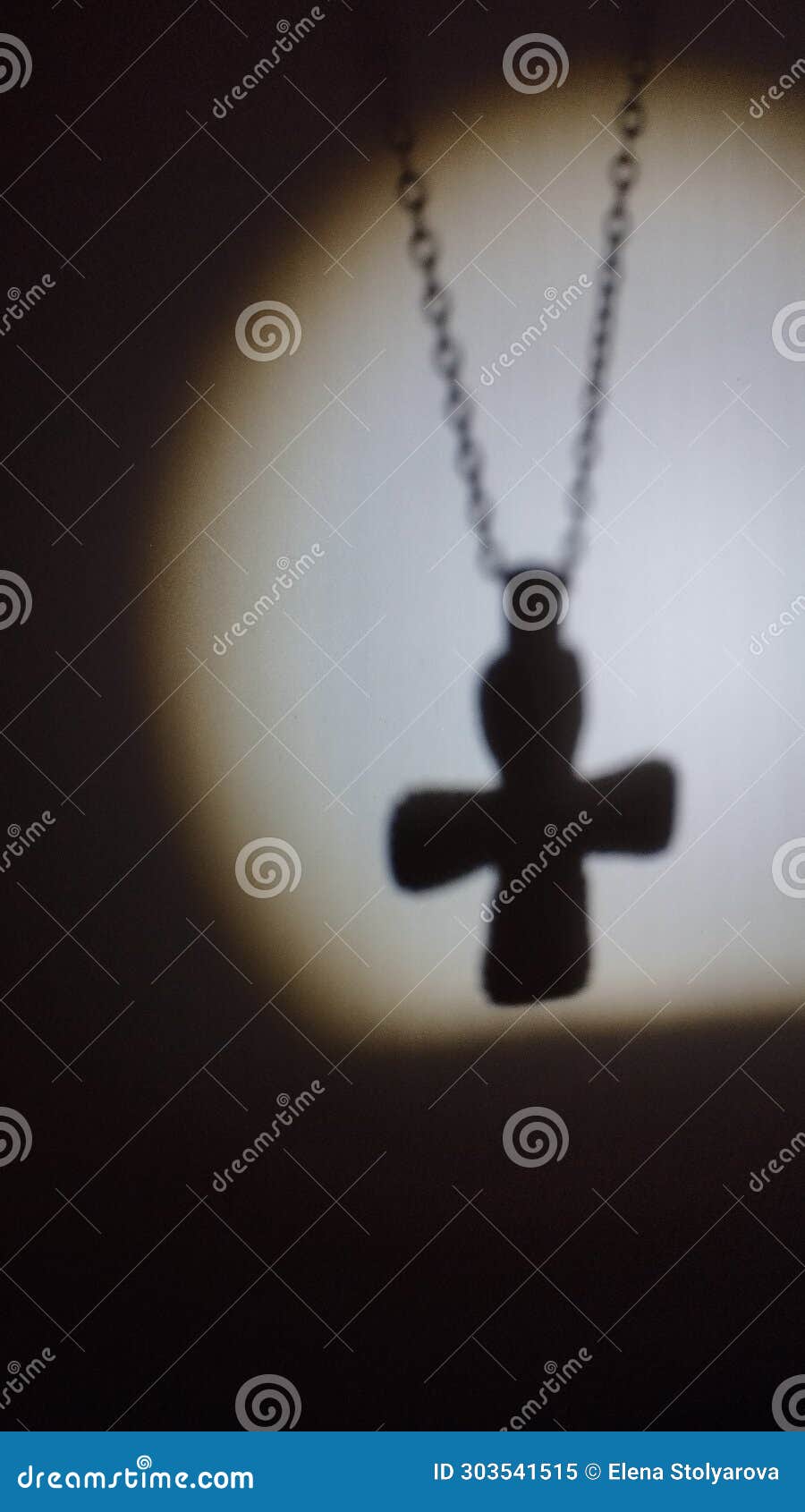 The Shadow of a Christian Cross on a Chain in the Light of a Lantern ...