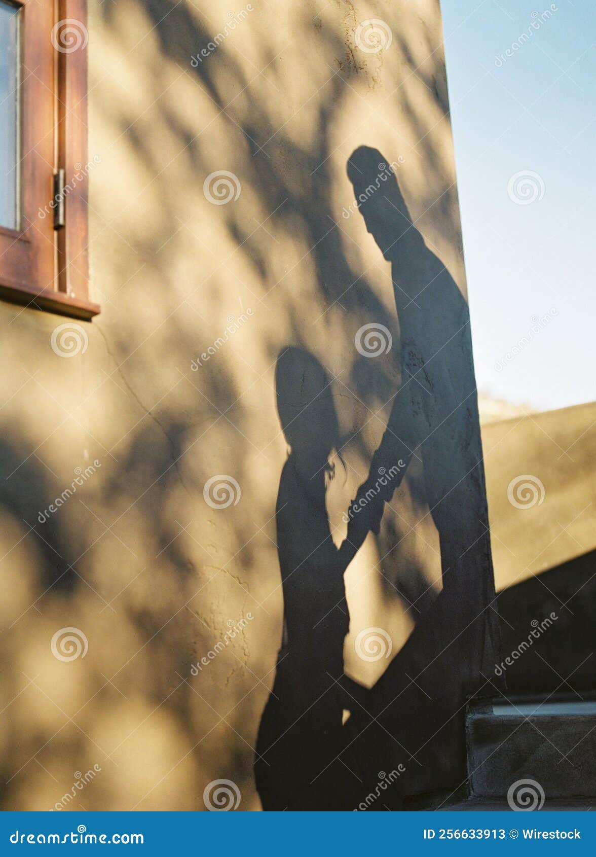 Shadow of a Couple on the Wall by Side, Vertical Shot Stock Image ...
