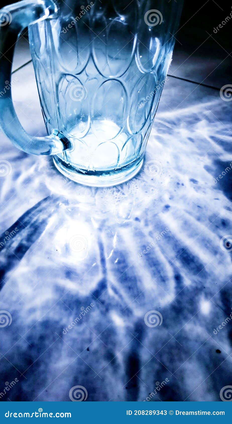 Shadow from cup stock image. Image of glow, light, beautiful - 208289343