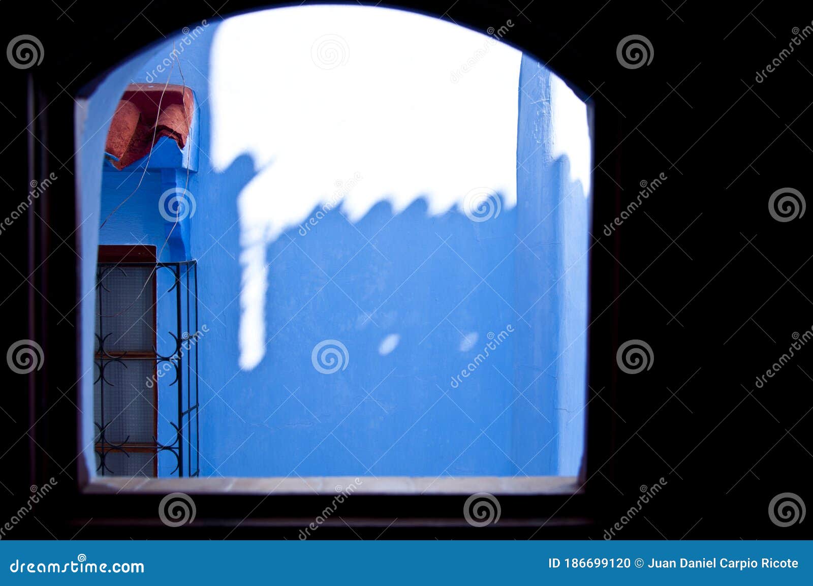 Shadow Detail by a Window with a Blue Wall Stock Photo - Image of ...