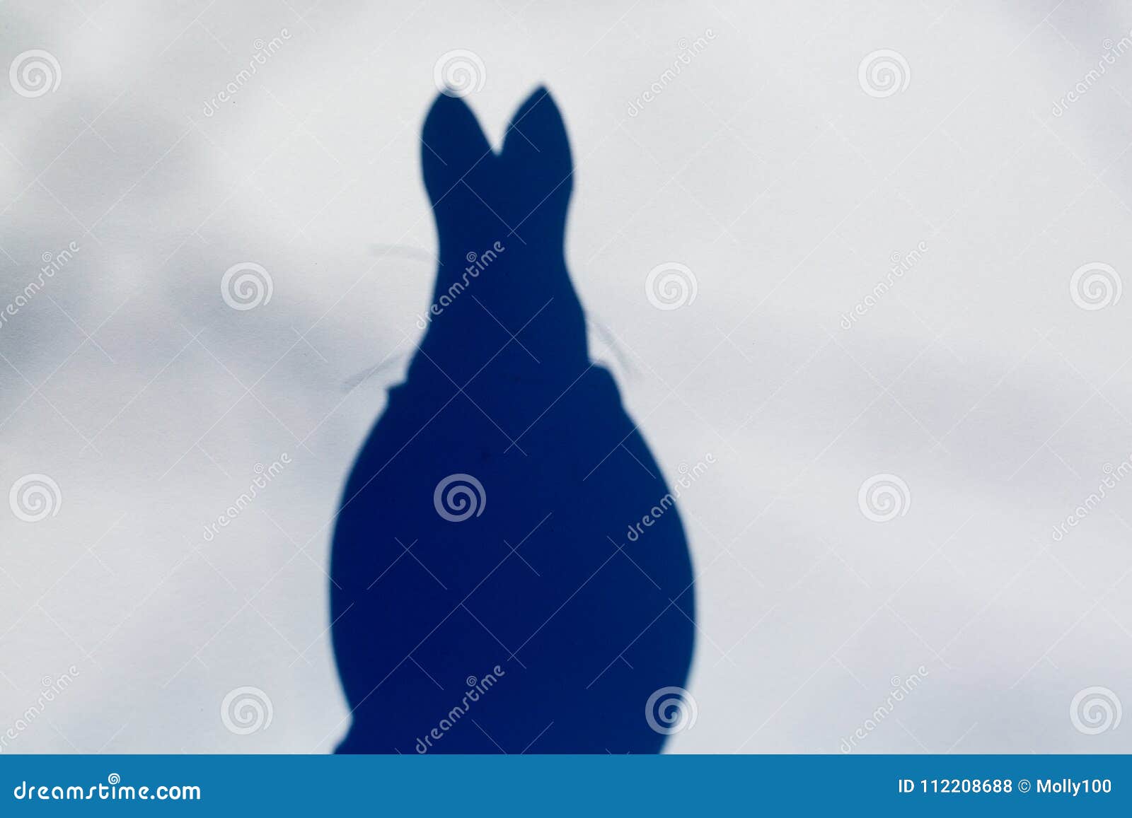 Bunny On A Background Of Blue Sky And Green Grass. Stock Image ...