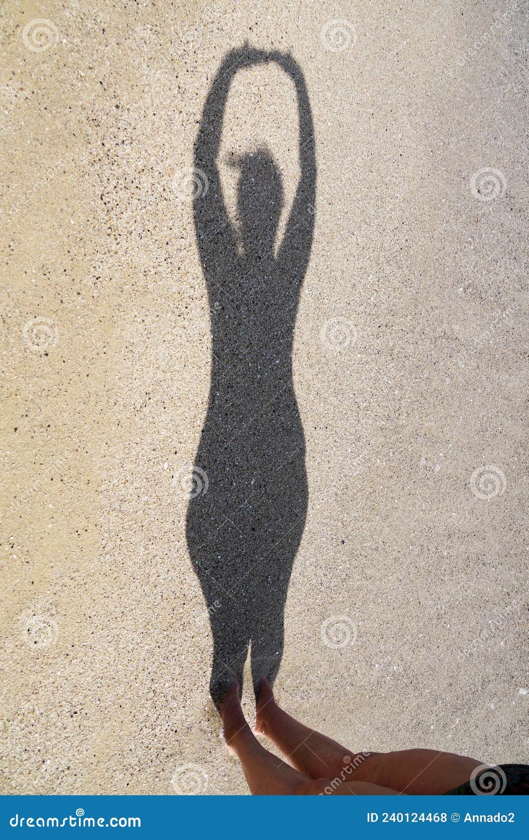 Shadow of a Female Figure with Raised Hands on the Sand Stock Photo ...