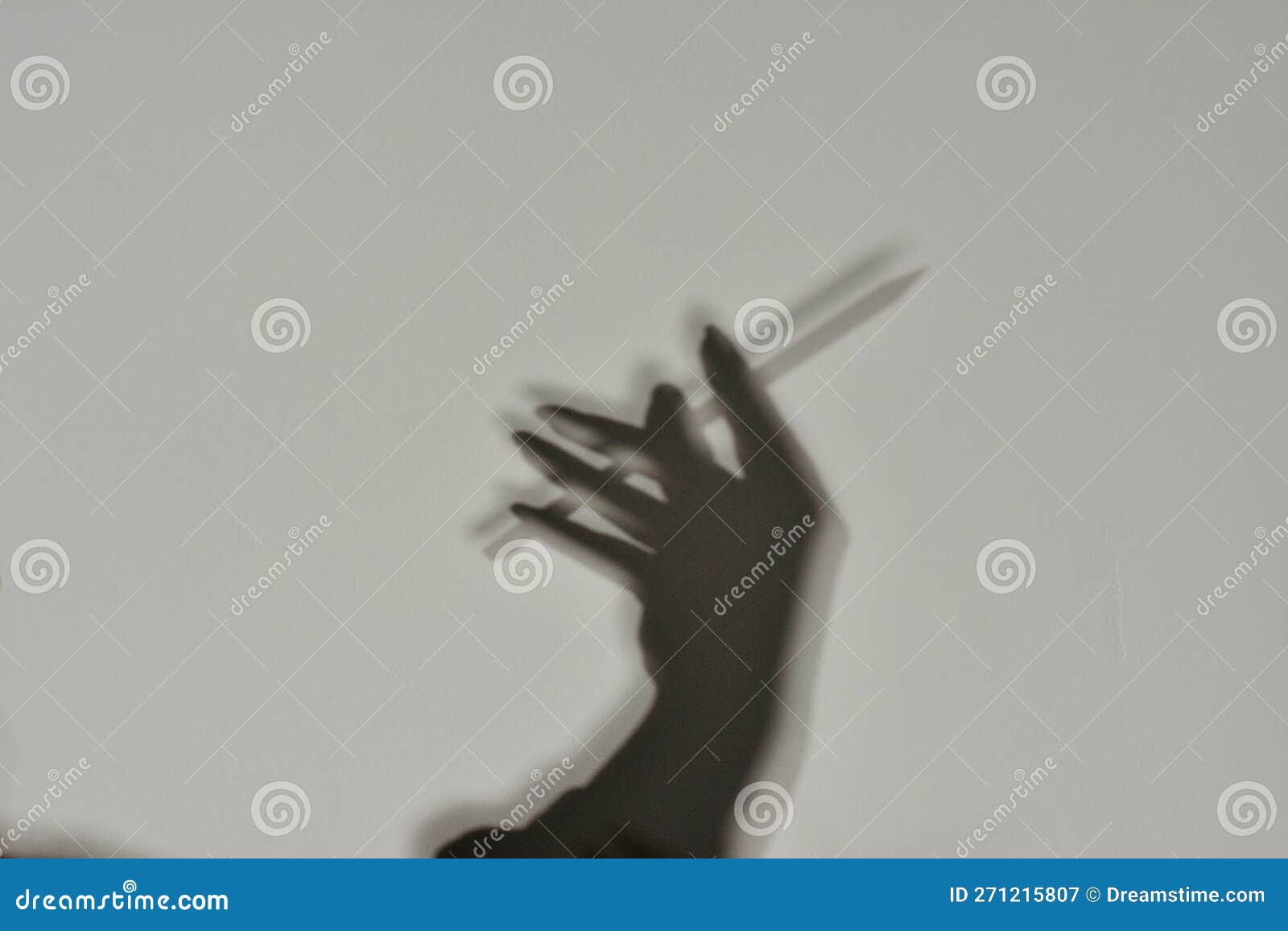 Shadow of the Female Hand Holding a Pencil , Sign on the Light Wall ...