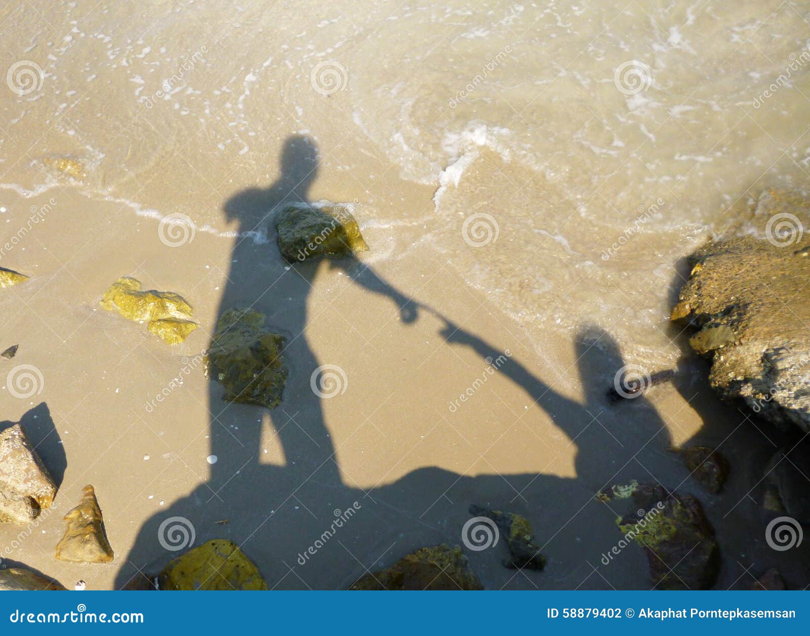 Shadow of Finger Touch on the Beach Stock Photo - Image of water, stone ...
