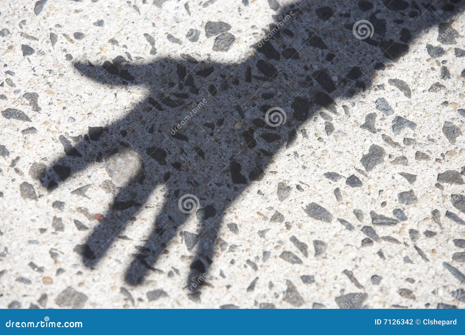Shadow of Hand Against Pavement Stock Photo - Image of shadow, pavement ...
