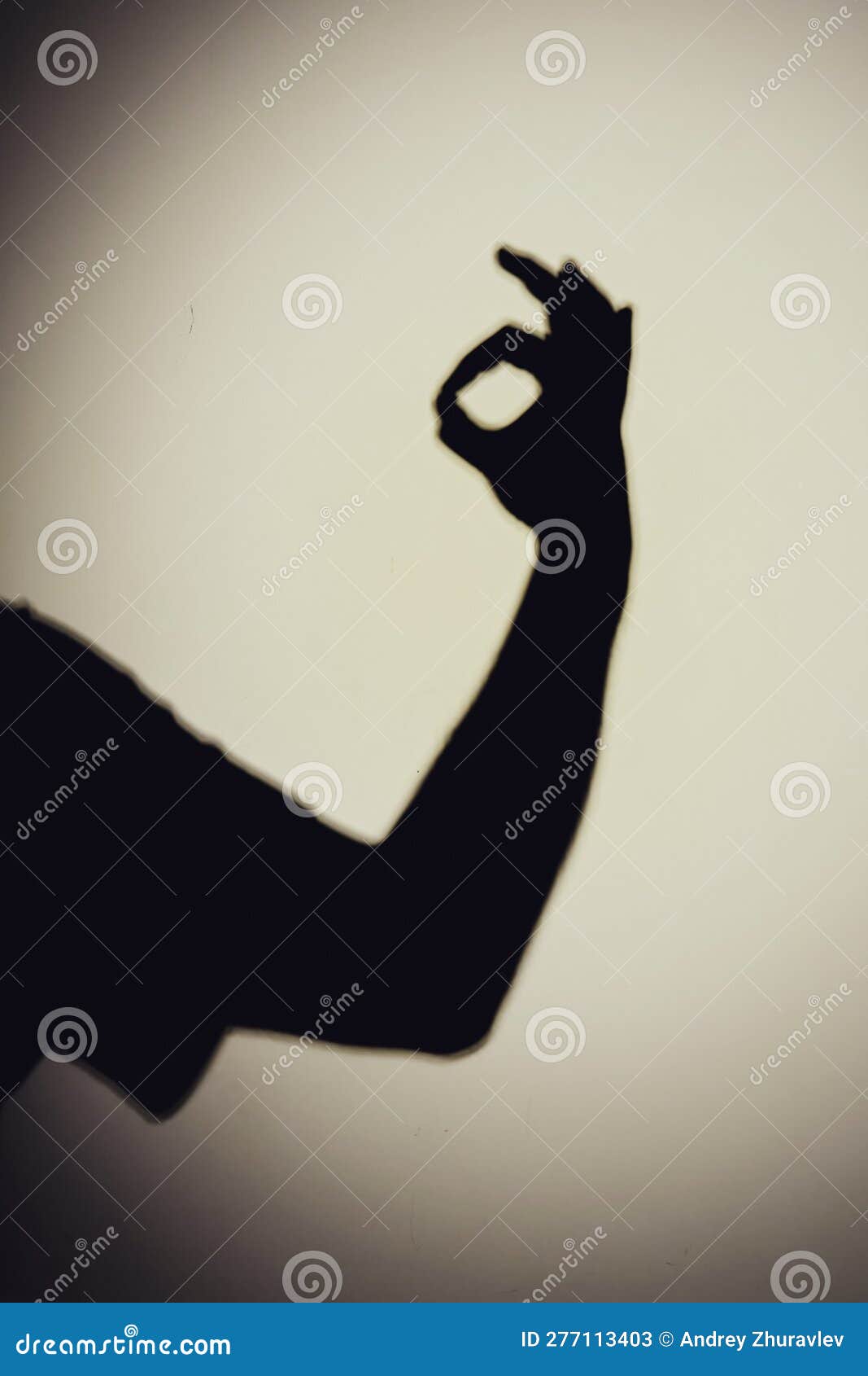 Shadow of a Hand from the Night Light of a Flashlight on a White Wall ...