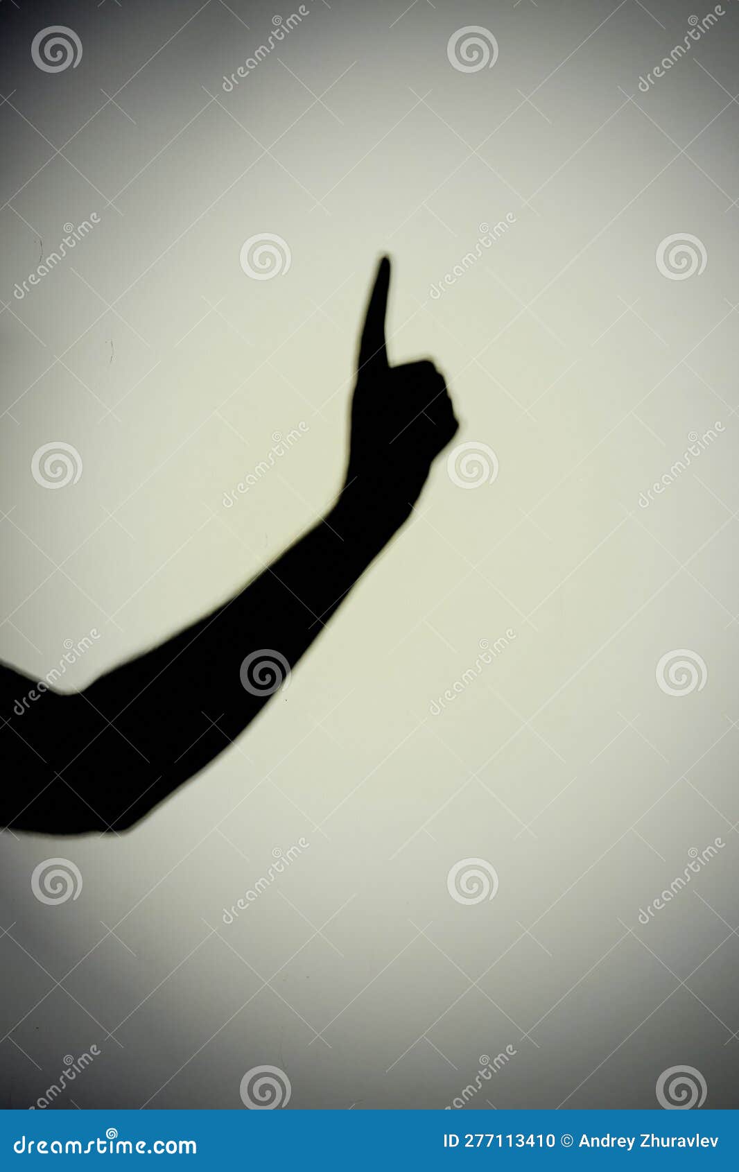 Shadow of a Hand from the Night Light of a Flashlight on a White Wall ...