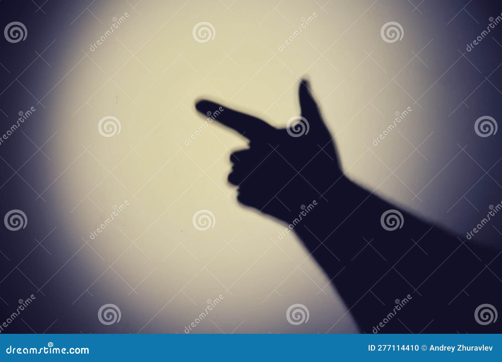 Shadow of a Hand from the Night Light of a Flashlight on a White Wall ...