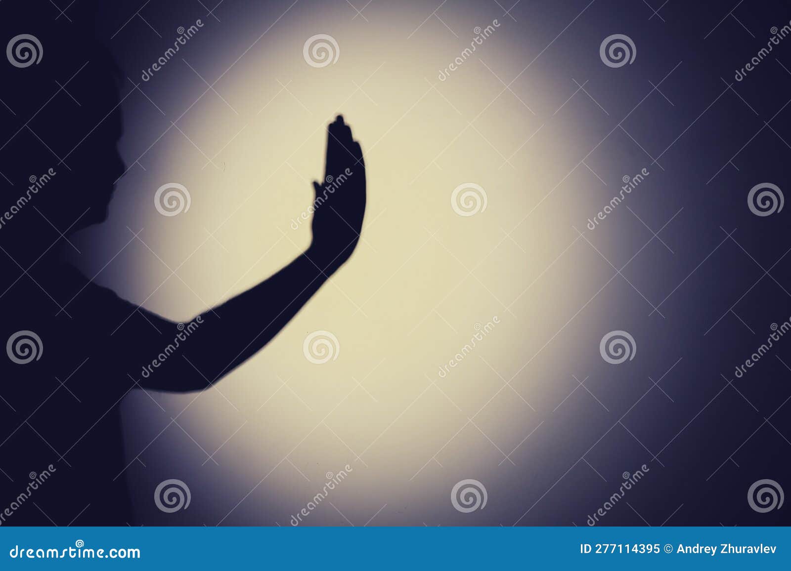 Shadow of a Hand from the Night Light of a Flashlight on a White Wall ...