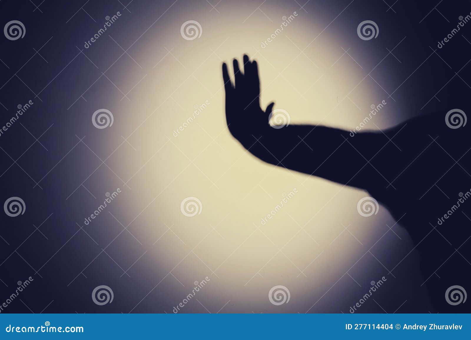 Shadow of a Hand from the Night Light of a Flashlight on a White Wall ...