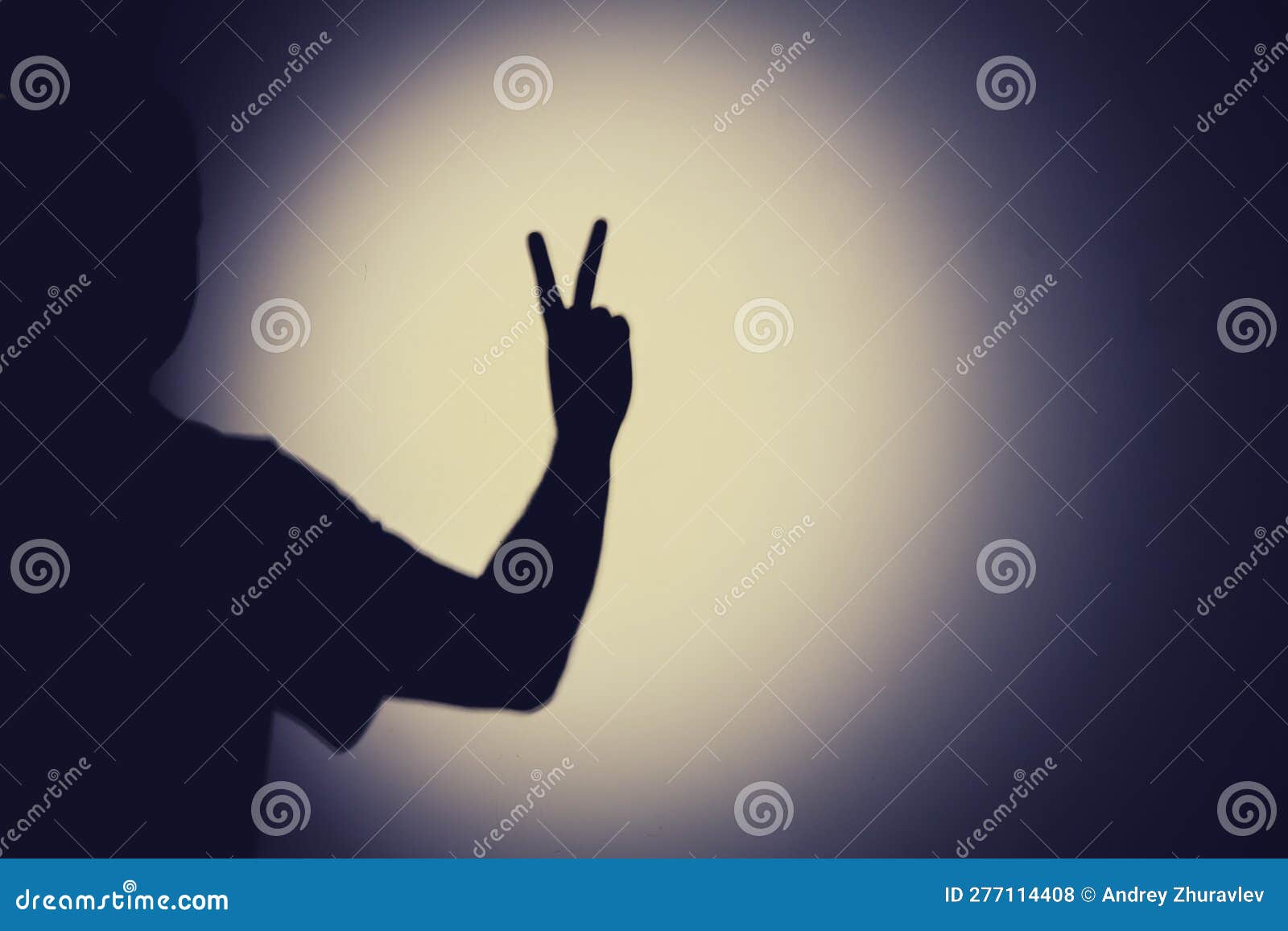 Shadow of a Hand from the Night Light of a Flashlight on a White Wall ...