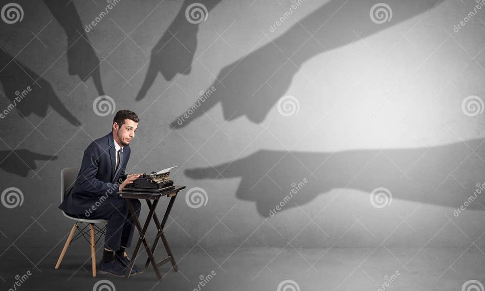 Shadow Hands Pointing at a Small Worker Stock Image - Image of article ...
