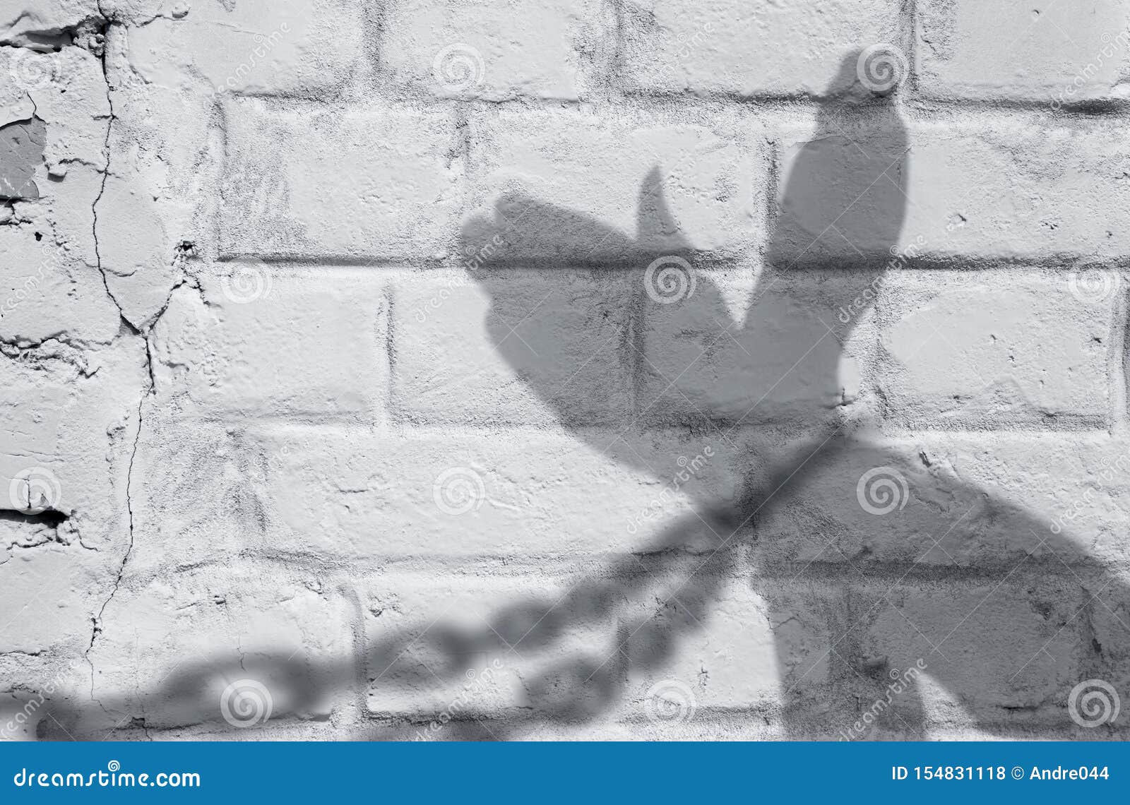 Shadow of Hands with Chains on a Brick Wall. Stock Photo - Image of ...