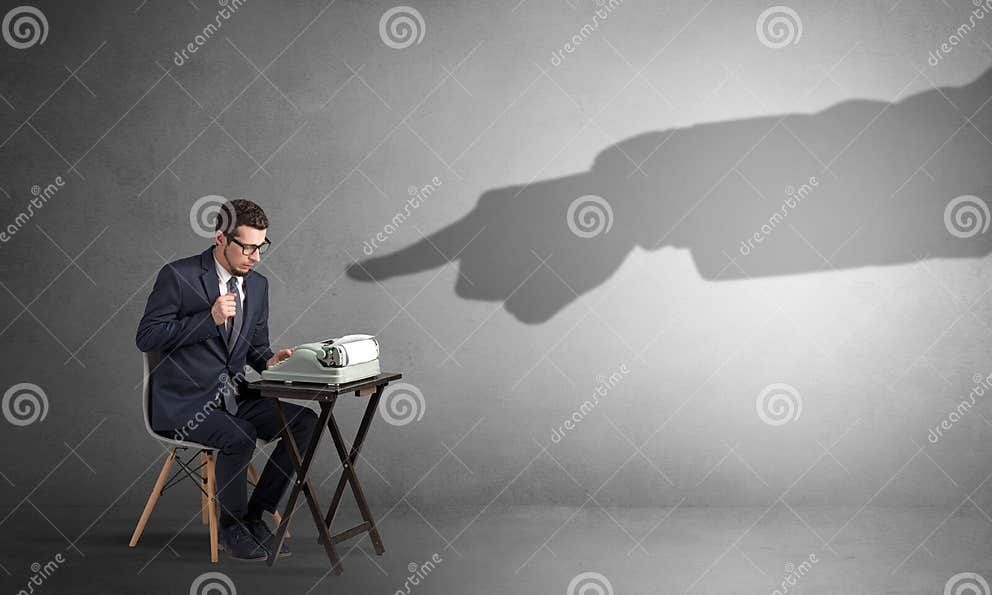 Shadow Hands Pointing at a Small Worker Stock Photo - Image of ...