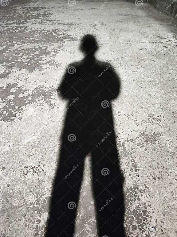 The Shadow of a Human Figure Standing Upright Stock Image - Image of ...