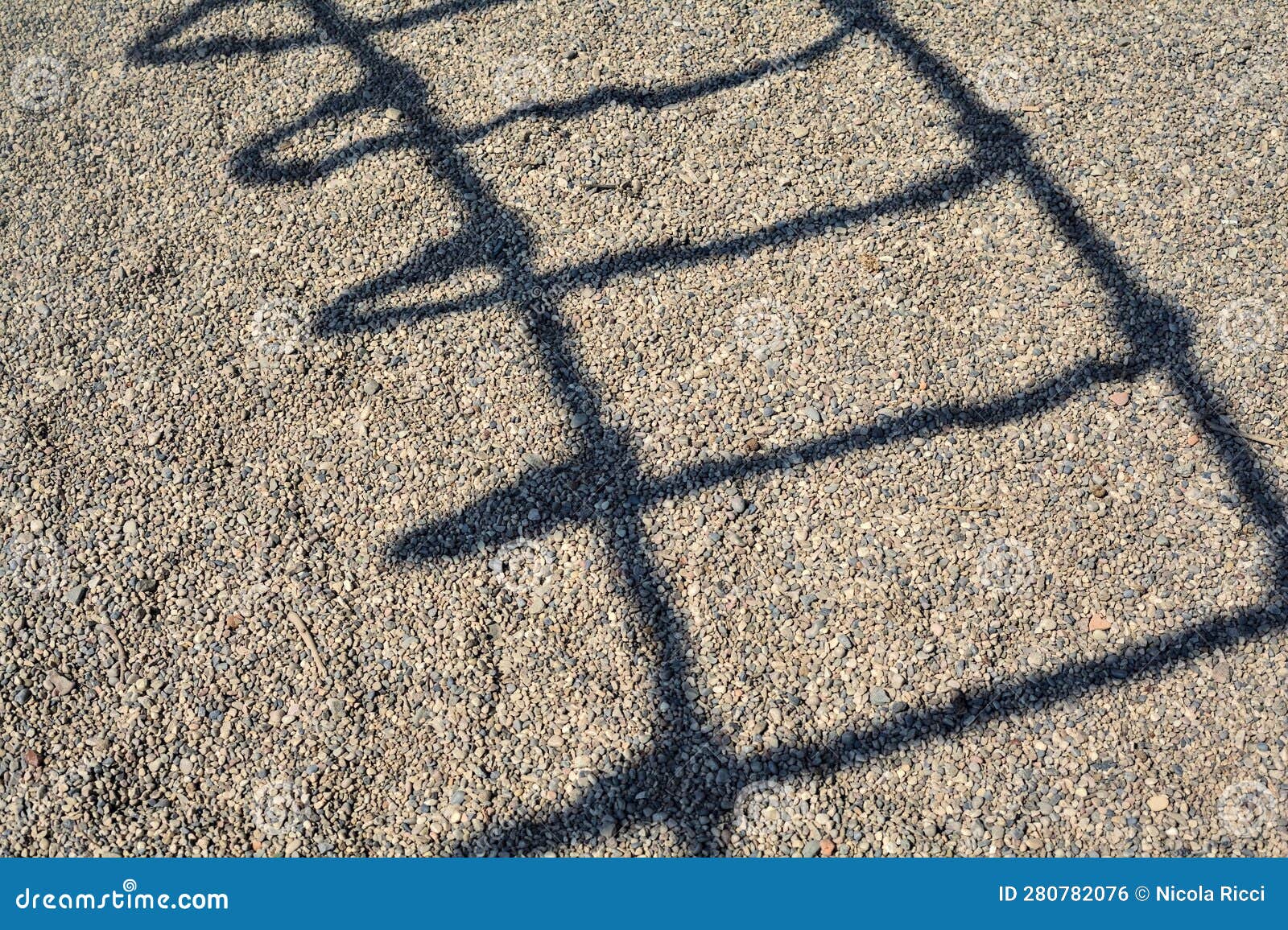 Shadow of a Ladder Casted on Pebbles Stock Photo - Image of empty ...