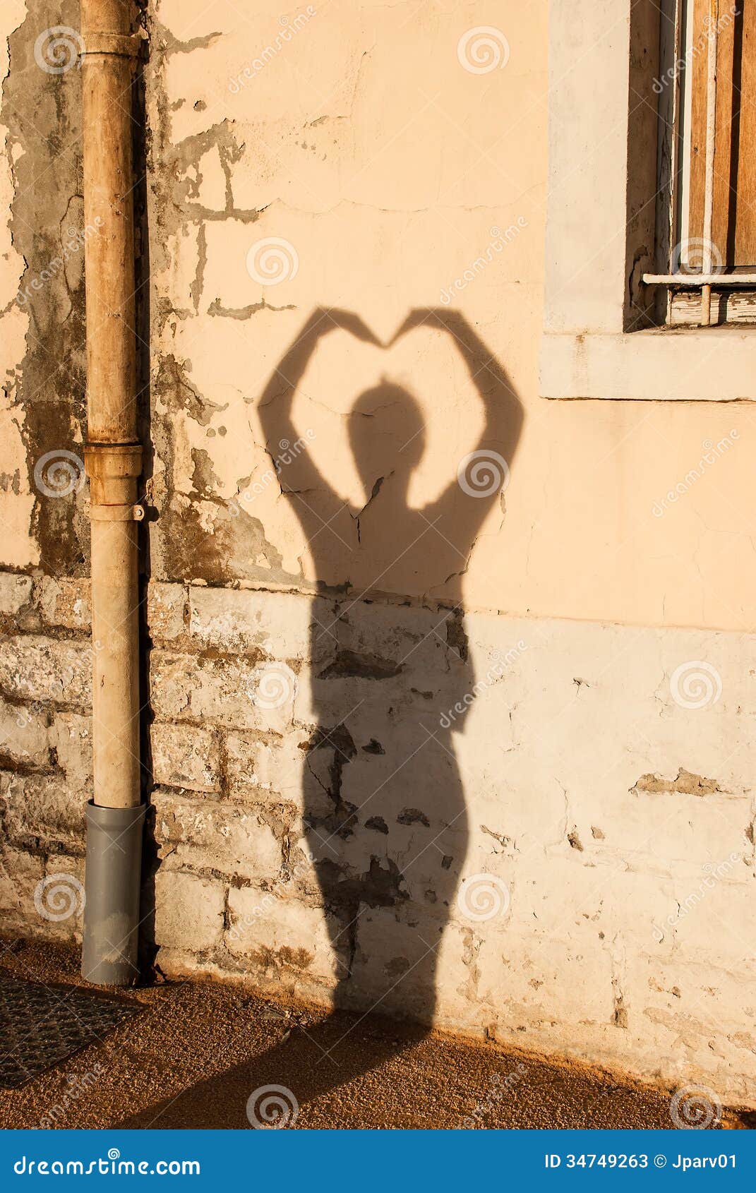 Shadow Making a Heart Shape Against a Wall Stock Image - Image of ...