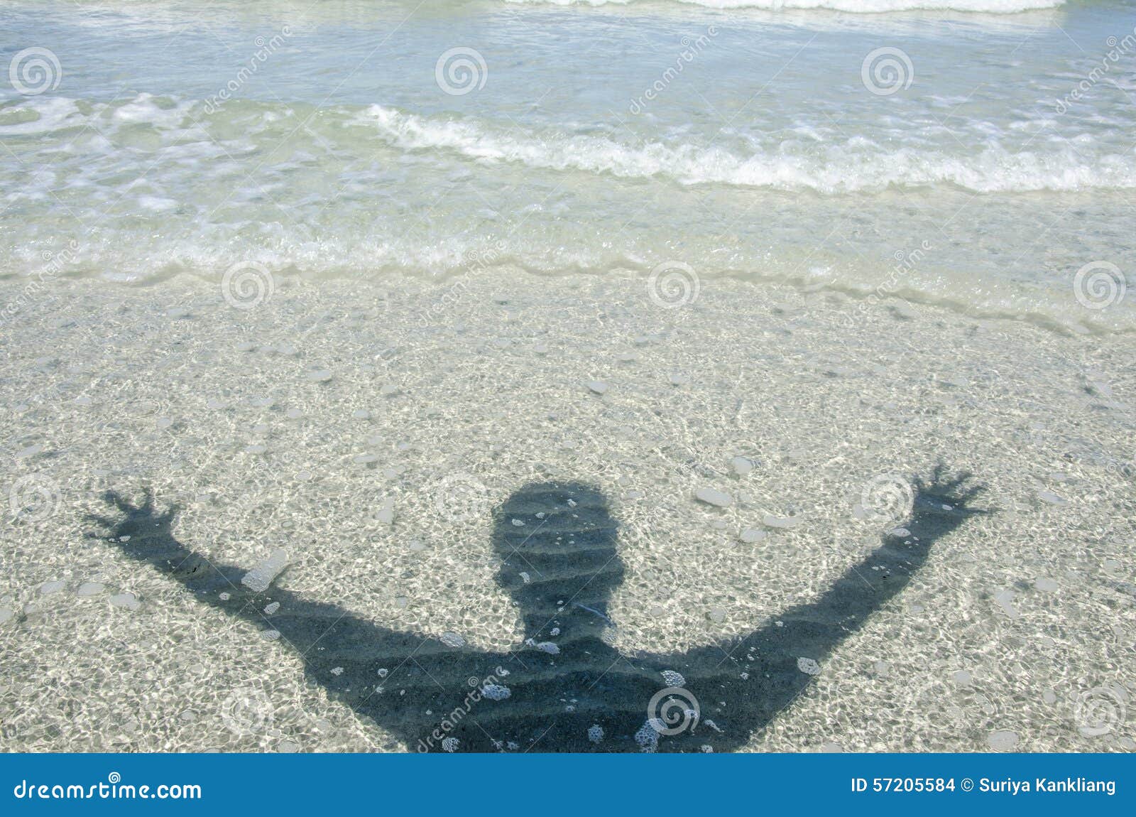 Shadow man on beach stock photo. Image of ocean, couple - 57205584