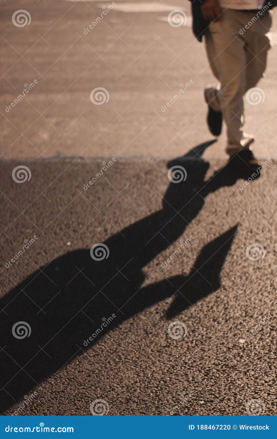 Shadow of a Man Jogging on the Asphalt on a Sunny Day Stock Photo ...