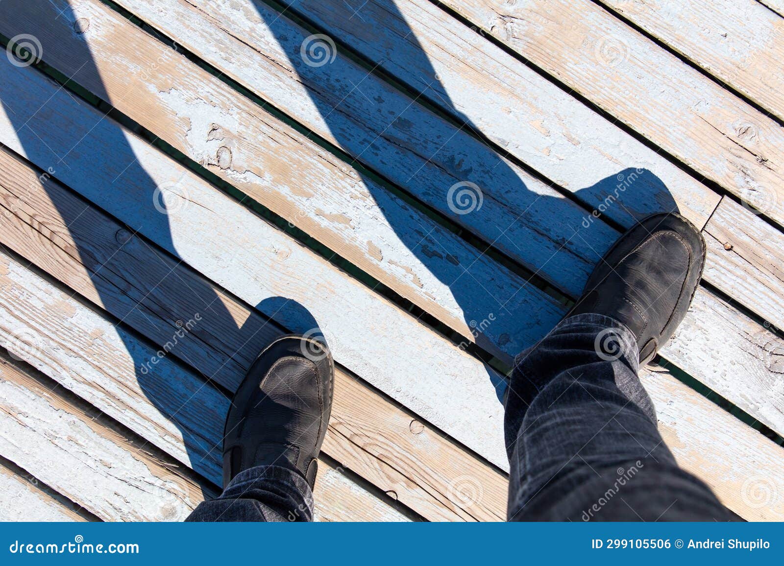 Shadow of a Man& X27;s Feet on a Wooden Floor Stock Photo - Image of ...