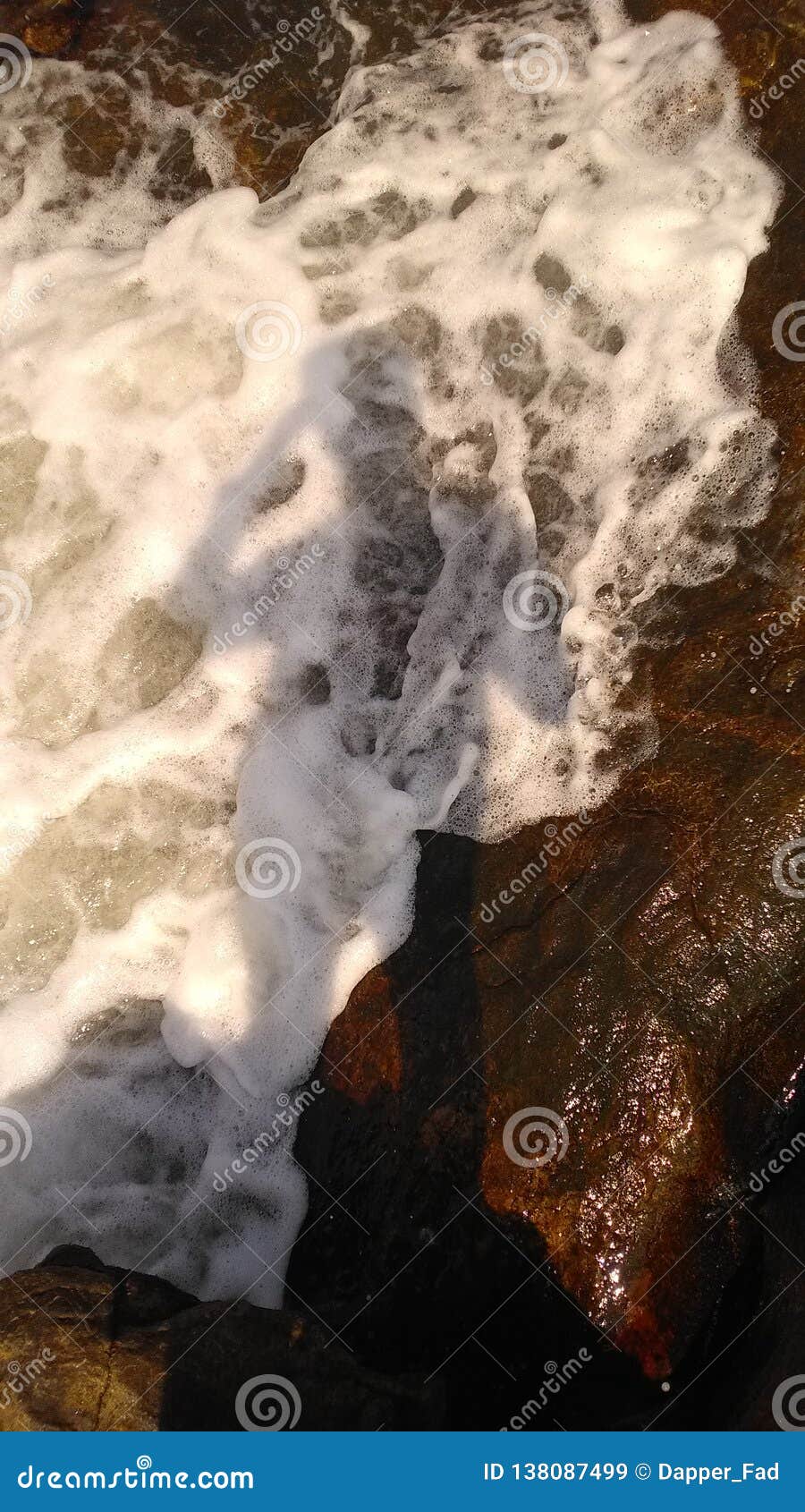 Shadow of man on sea wave stock image. Image of wave - 138087499