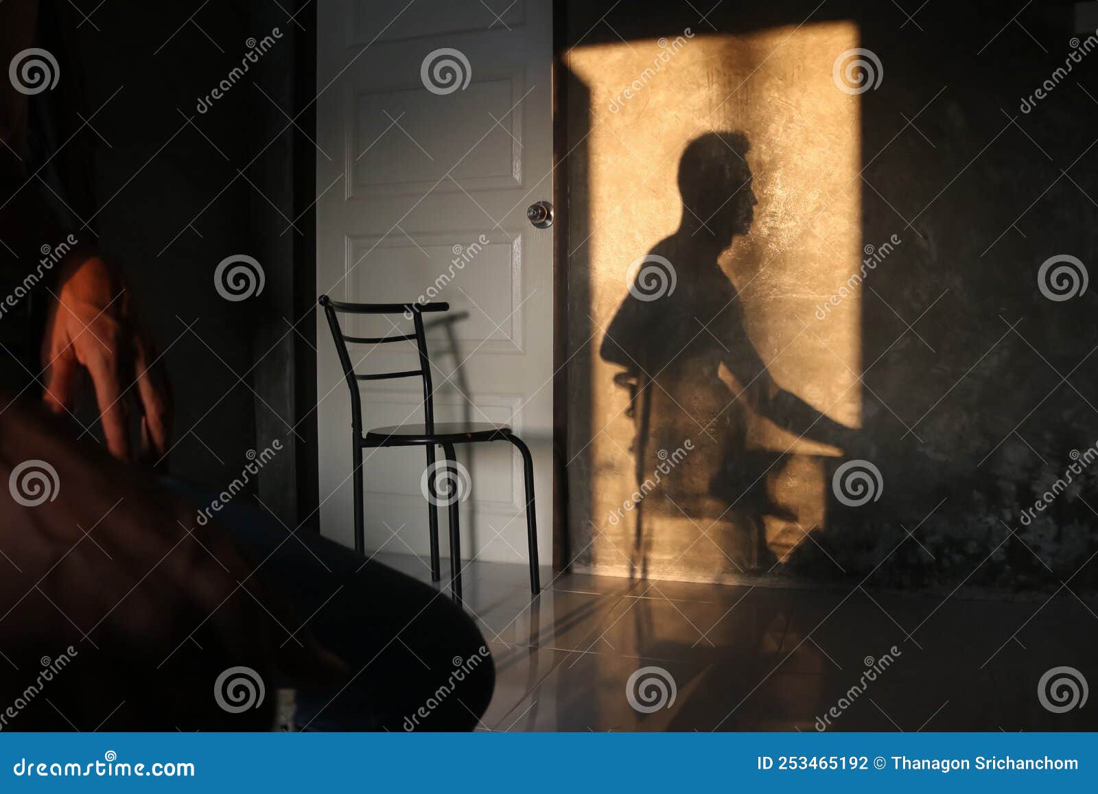 The Shadow of a Man Sitting in a Chair on the Wall Stock Photo - Image ...