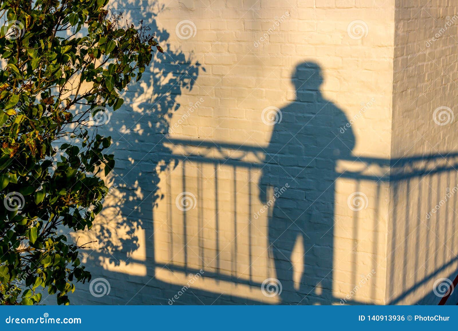 The Shadow of a Man on a White Building Wall Stock Photo - Image of ...