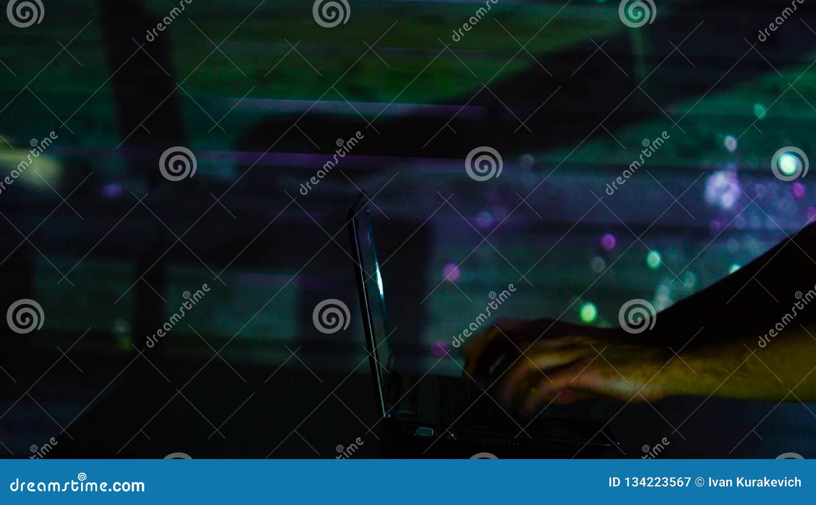 The Shadow of a Man Working at a Computer with Fireworks. Work on a ...