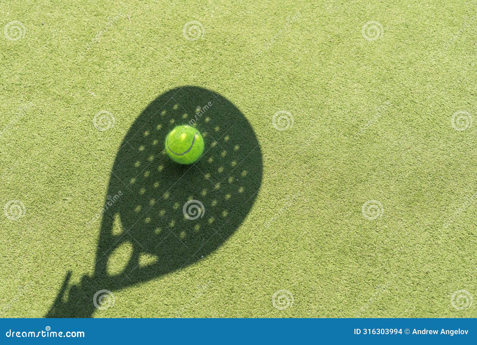 Shadow of a Padel Racket with a Yellow Ball on the Green Grass. Stock ...