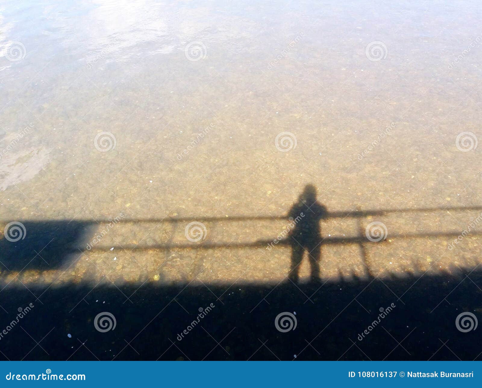 Shadow Of Person Or Silhouette Alone Standing On The Bridge And ...