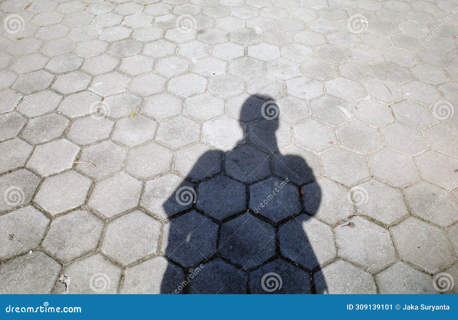 A Shadow of Person Standing on the Block Floor, in the Morning Stock ...