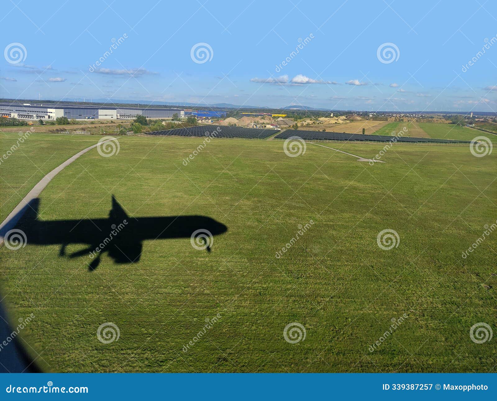 Shadow of a Plane during Landing on the Airport Green Grass Stock Image ...