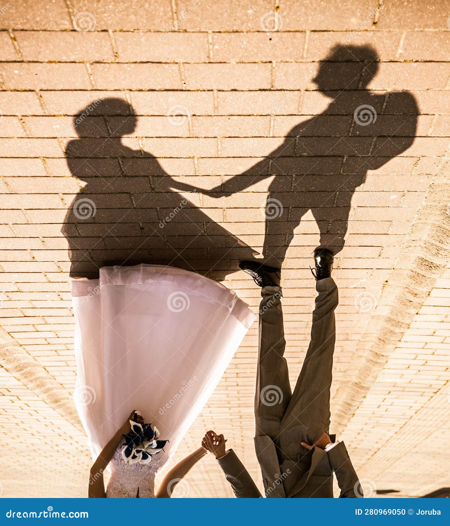 Shadow of Posing Wedding Couple on Ground Stock Photo - Image of posing ...