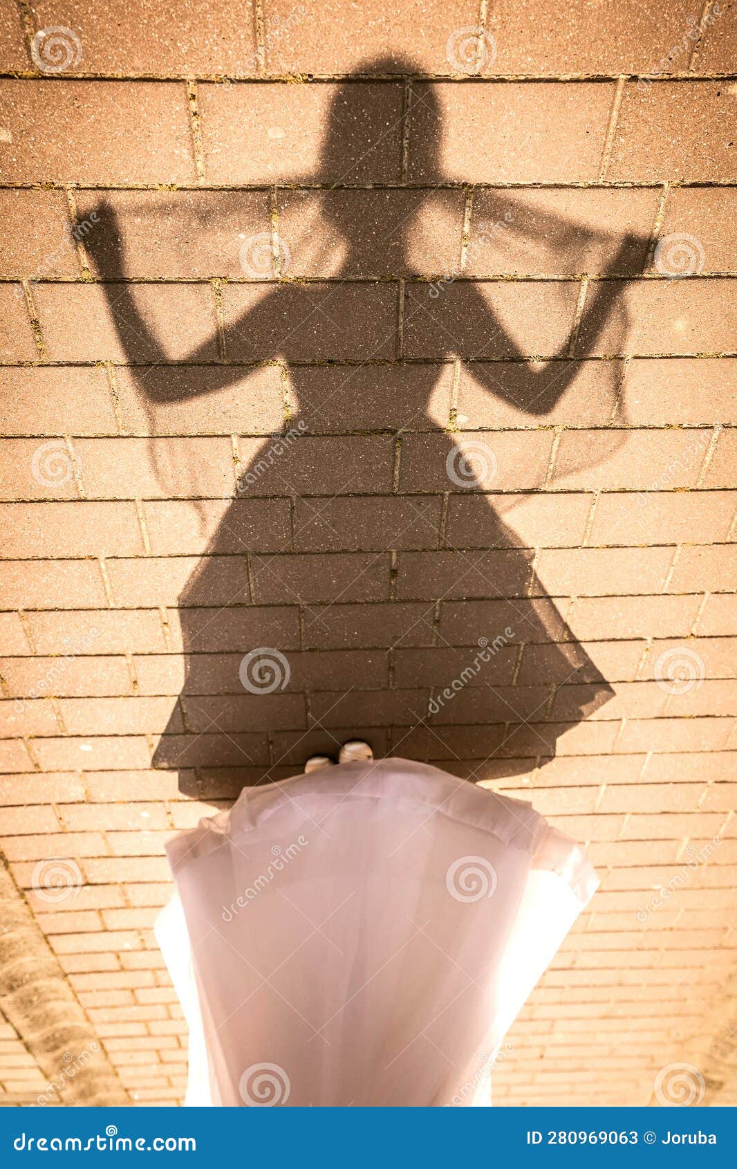Shadow of Posing Wedding Couple on Ground Stock Image - Image of ...
