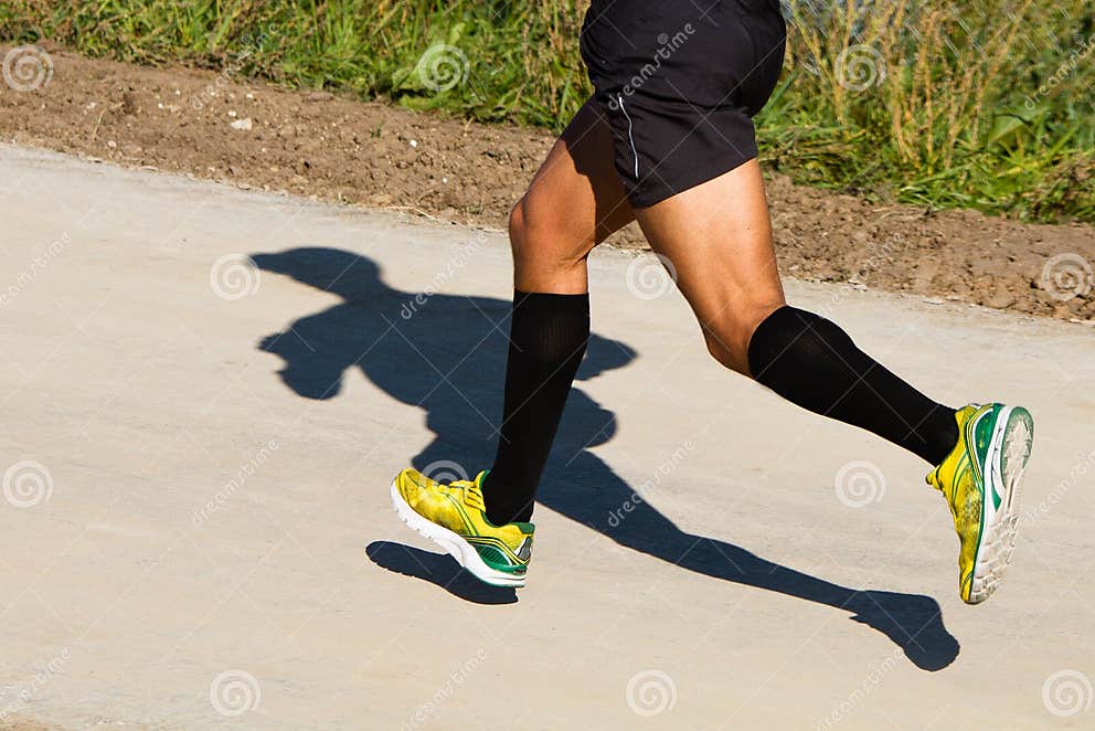 Shadow of a runner stock photo. Image of condition, asphalt - 21636378