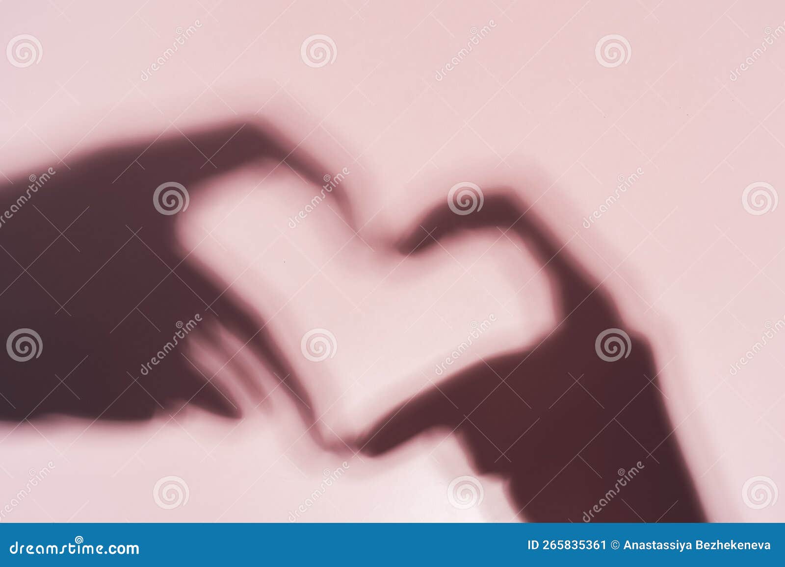 Shadow in the Shape of a Heart from the Hands on a Pink Background ...
