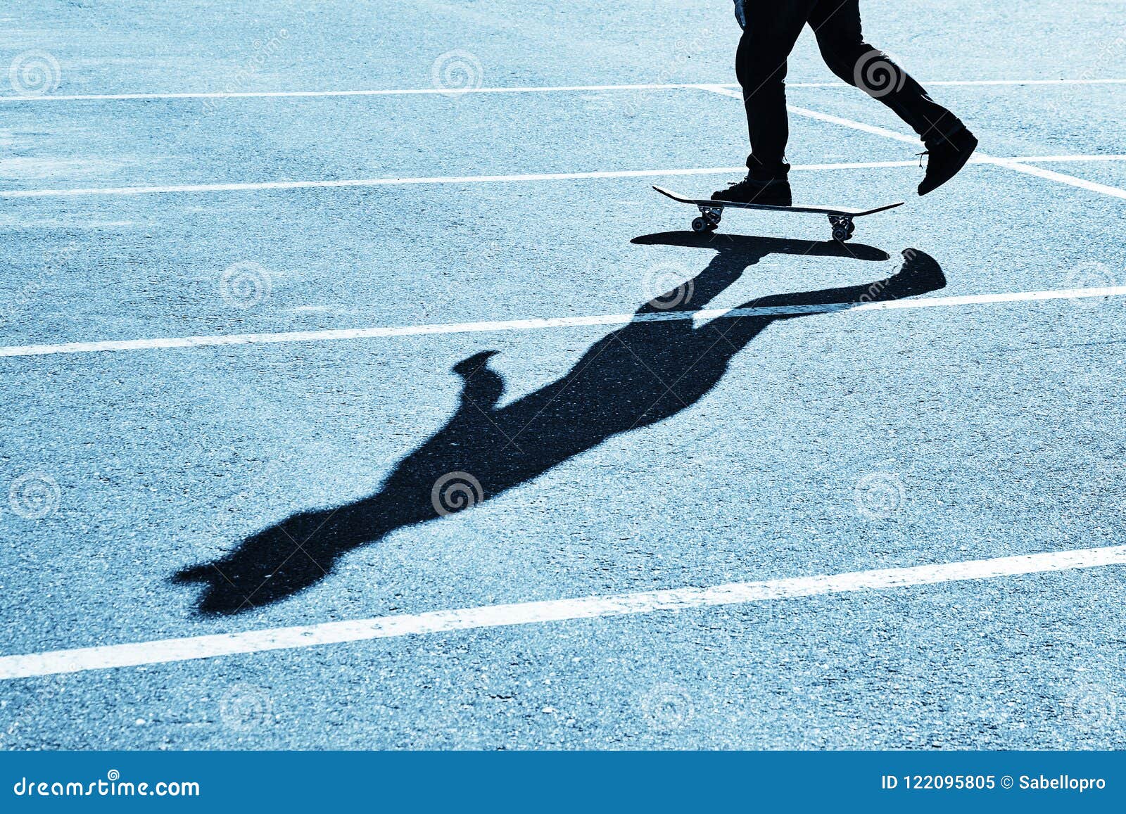 Shadow of a Skateboarder on Asphalt. Blue Toning Stock Image - Image of ...