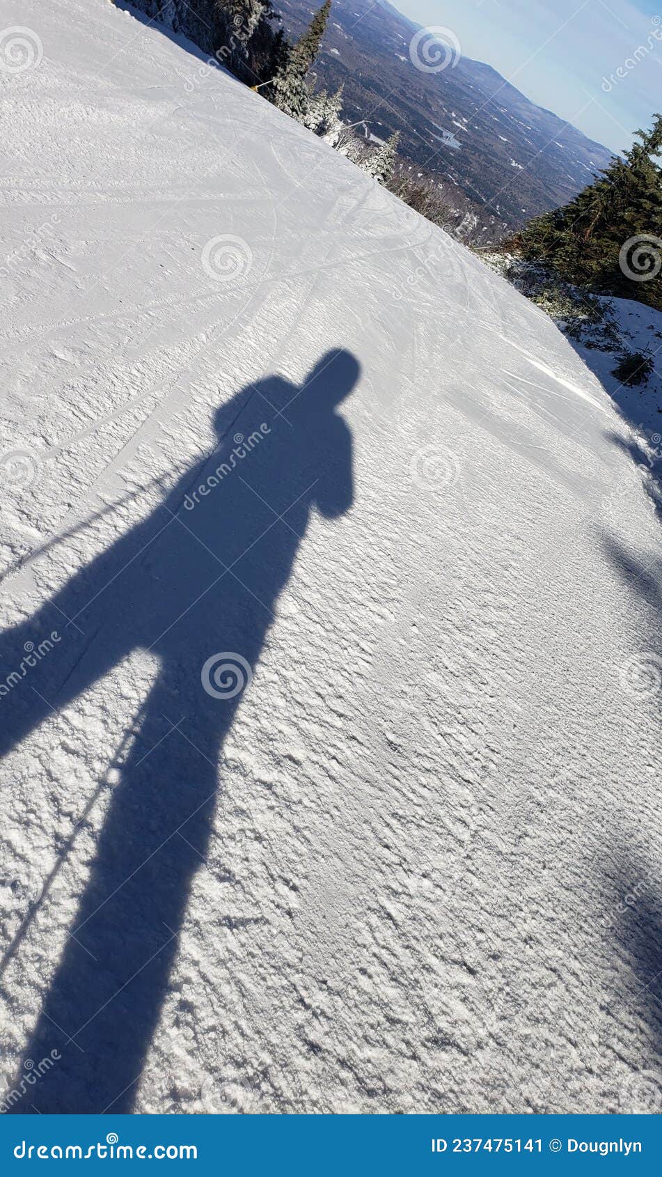 Is Shadow of a Skier Looking Down Hill Towards Mountain Vista Stock ...