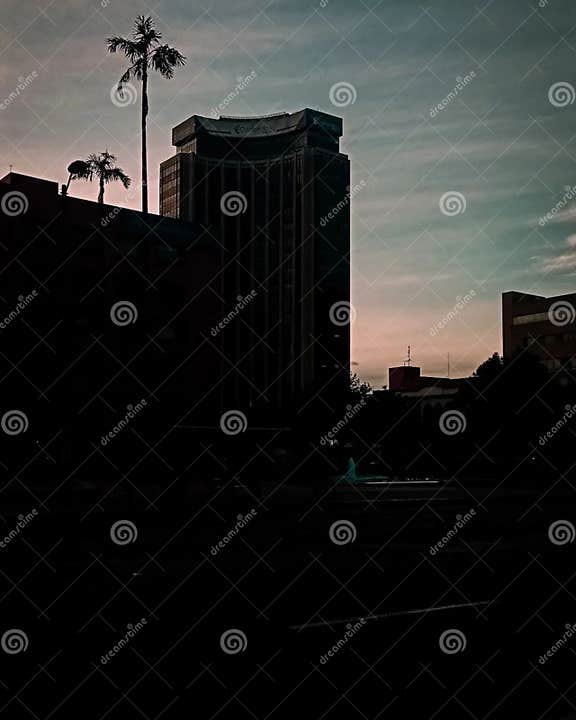 The Shadow of a Skyscraper at Dusk Creates a Striking and Dramatic ...
