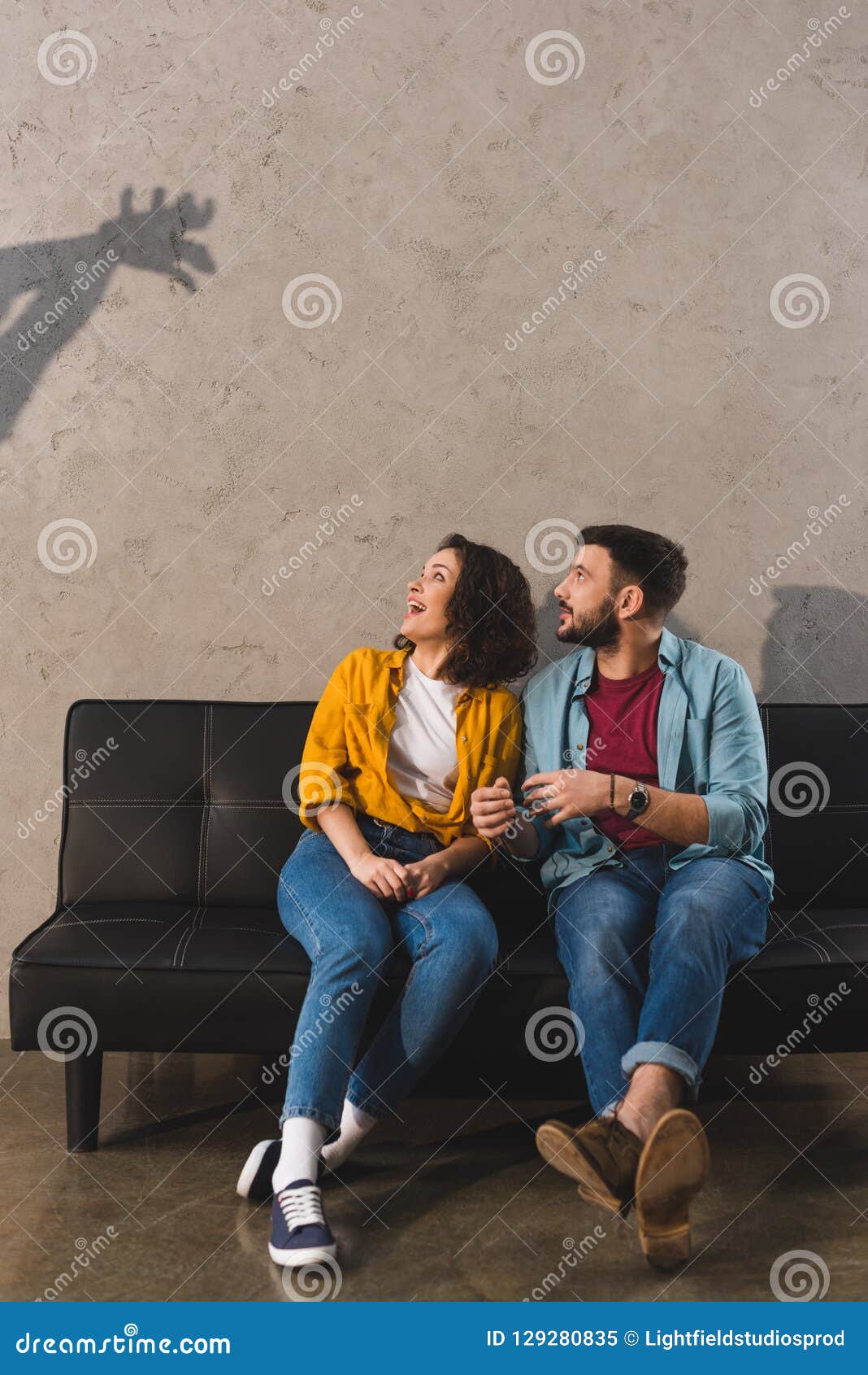 Shadow on Wall and Couple Sitting Stock Image - Image of female, device ...