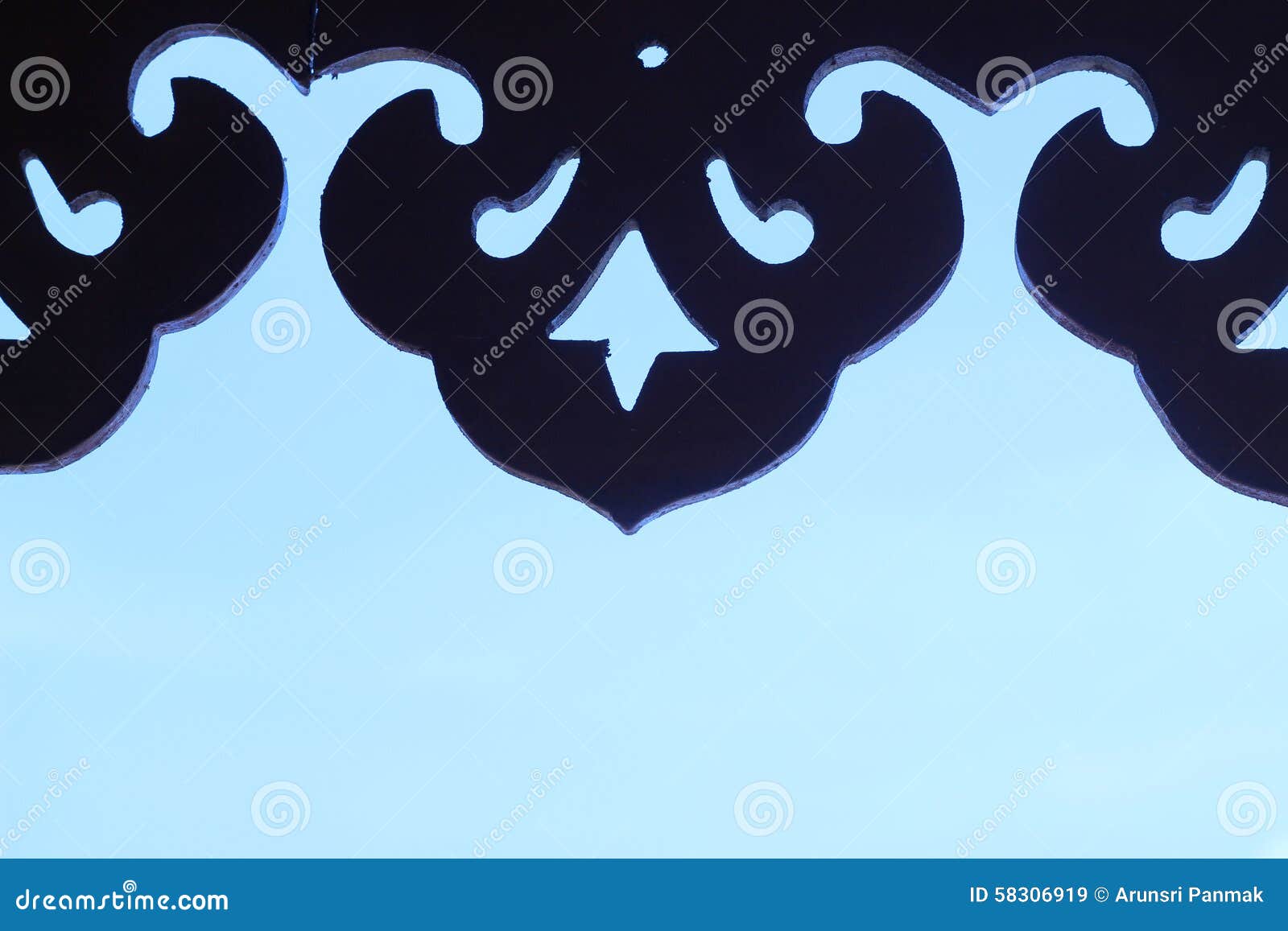 Shadow is a Wood Carving of the Sky in the Background Stock Image ...