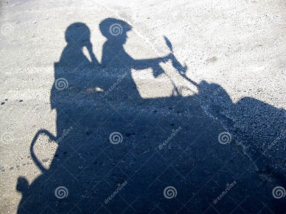 Shadow from a Young Pair on the Motor Scooter Stock Image - Image of ...