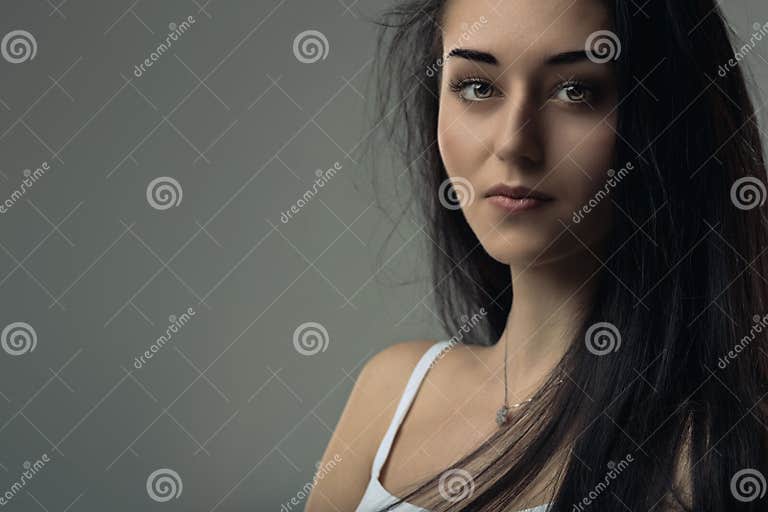Shadowing Accentuates Her Contemplative, Refined Features Stock Image ...