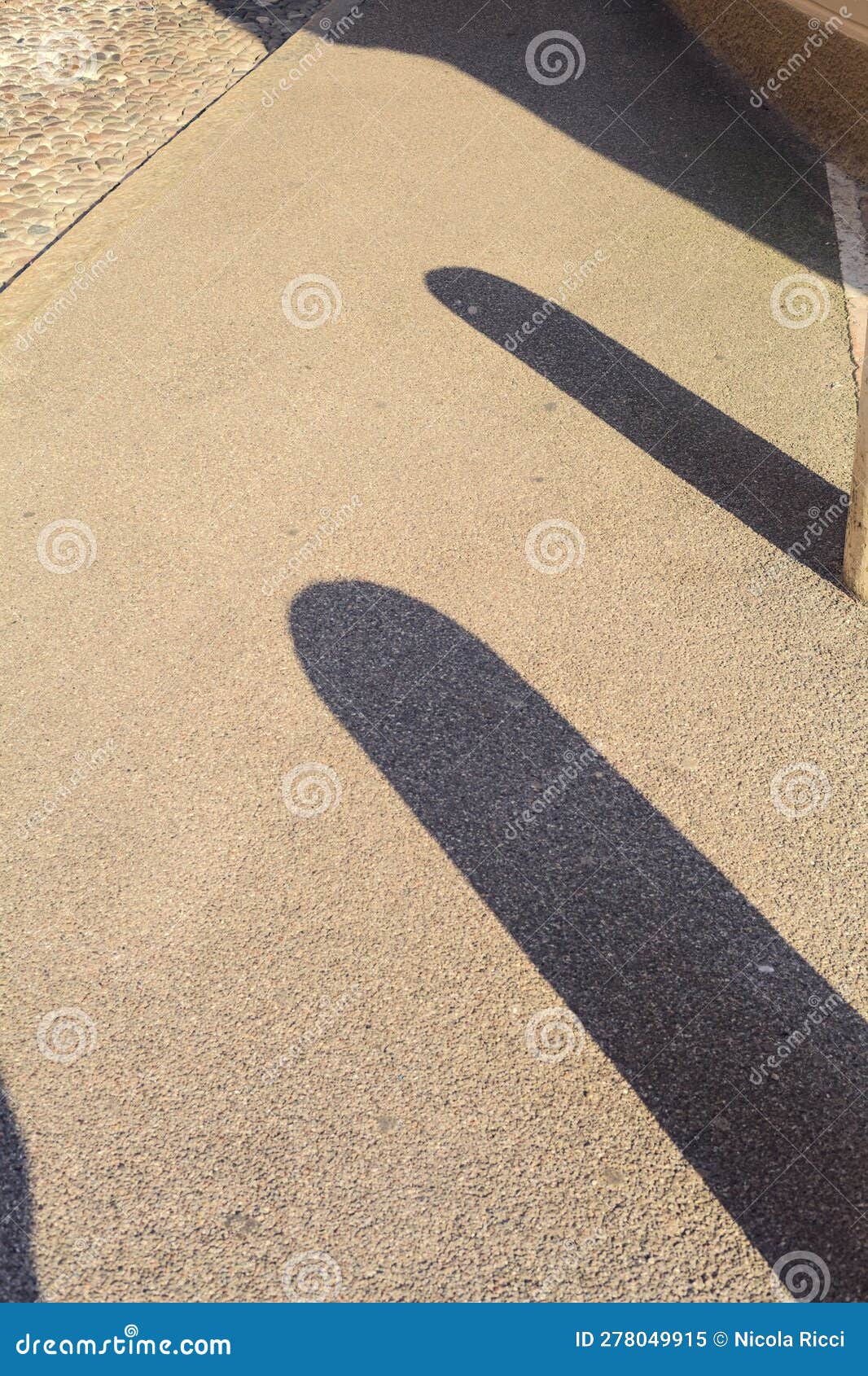 Shadows Casted by Stone Pillars on a Pavement at Sunset Stock Image ...