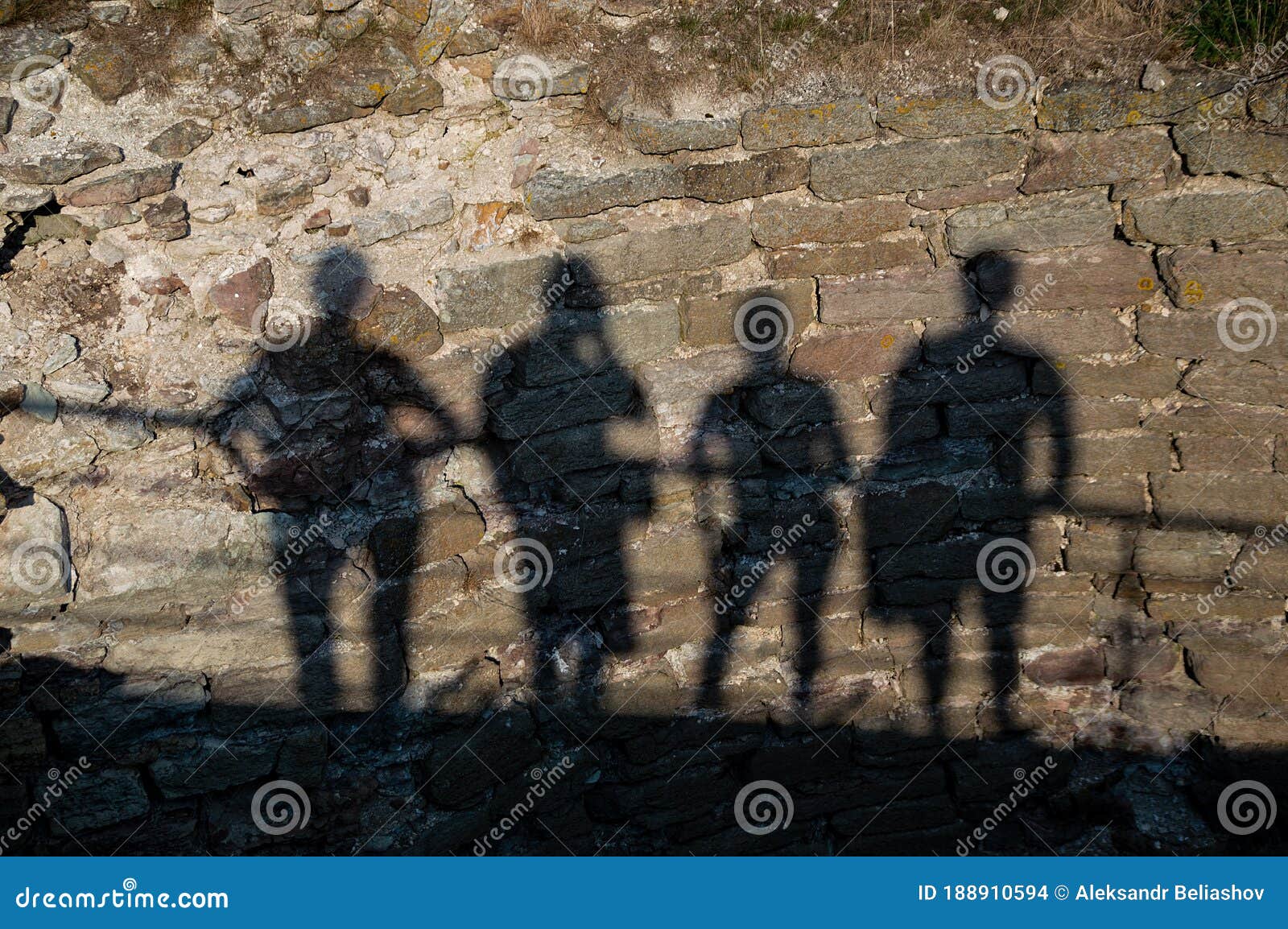 Shadows from Four People on the Wall Stock Photo - Image of shape ...