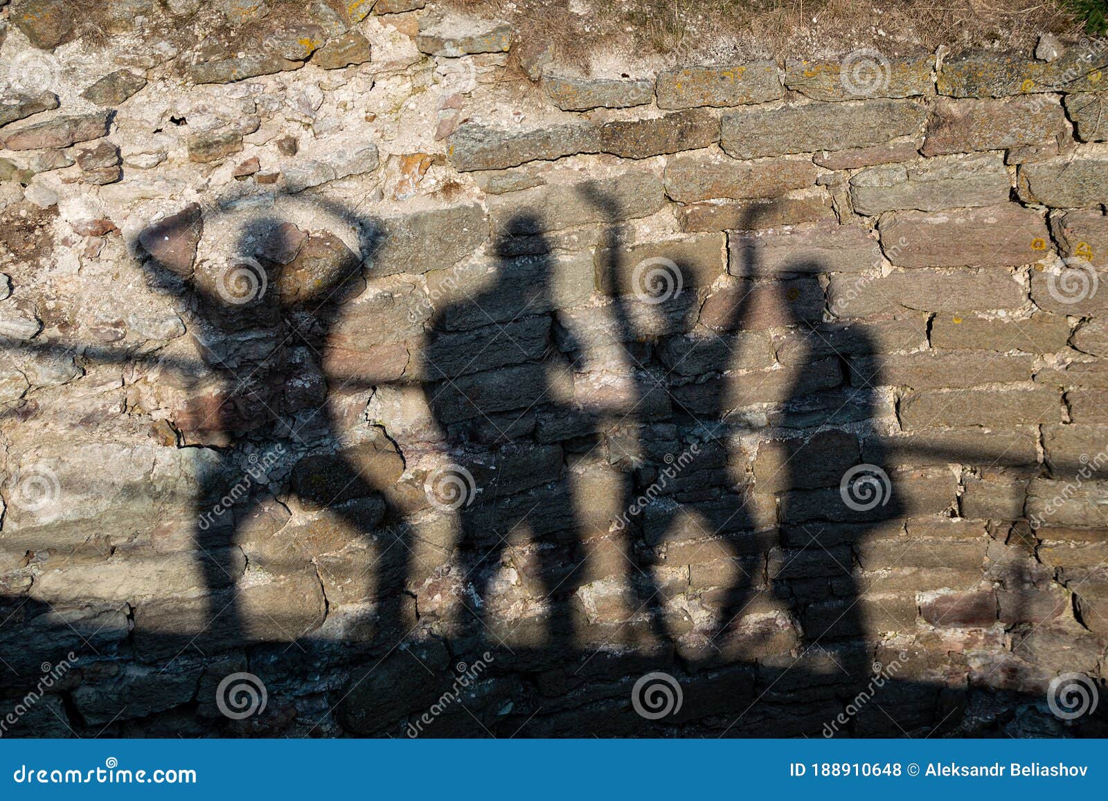 Shadows from Four People on the Wall Stock Photo - Image of outline ...